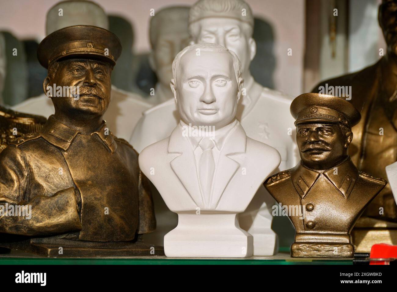 Figurines depicting Russian President Vladimir Putin, centre, and ...