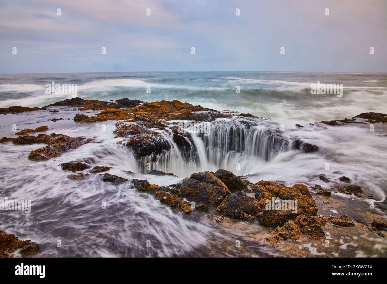 Ocean Waterfall Over Rocks at Thor's Well Oregon - Aerial View Stock ...
