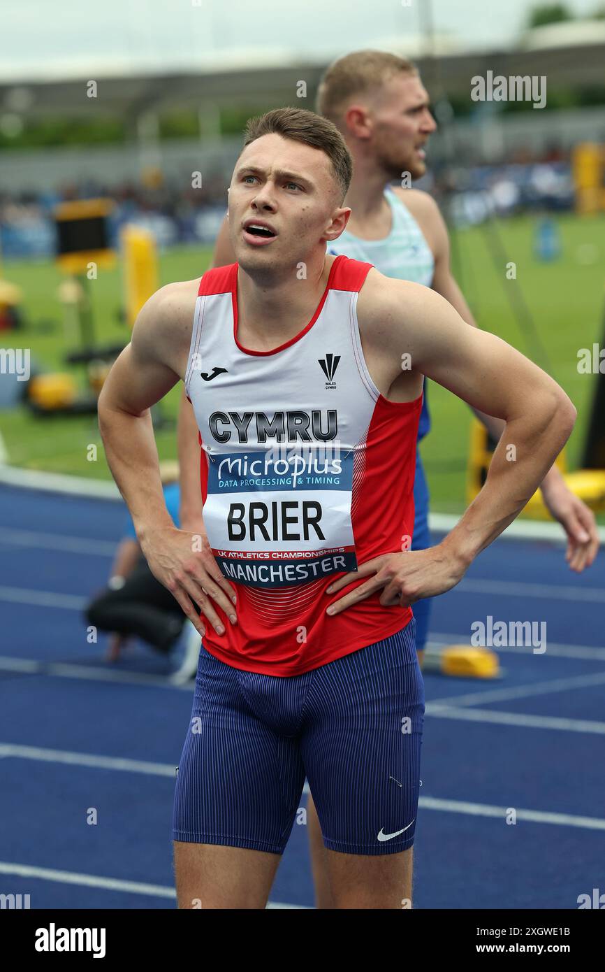 Joseph BRIER of Swansea Harriers watching the replay of his heat of the ...