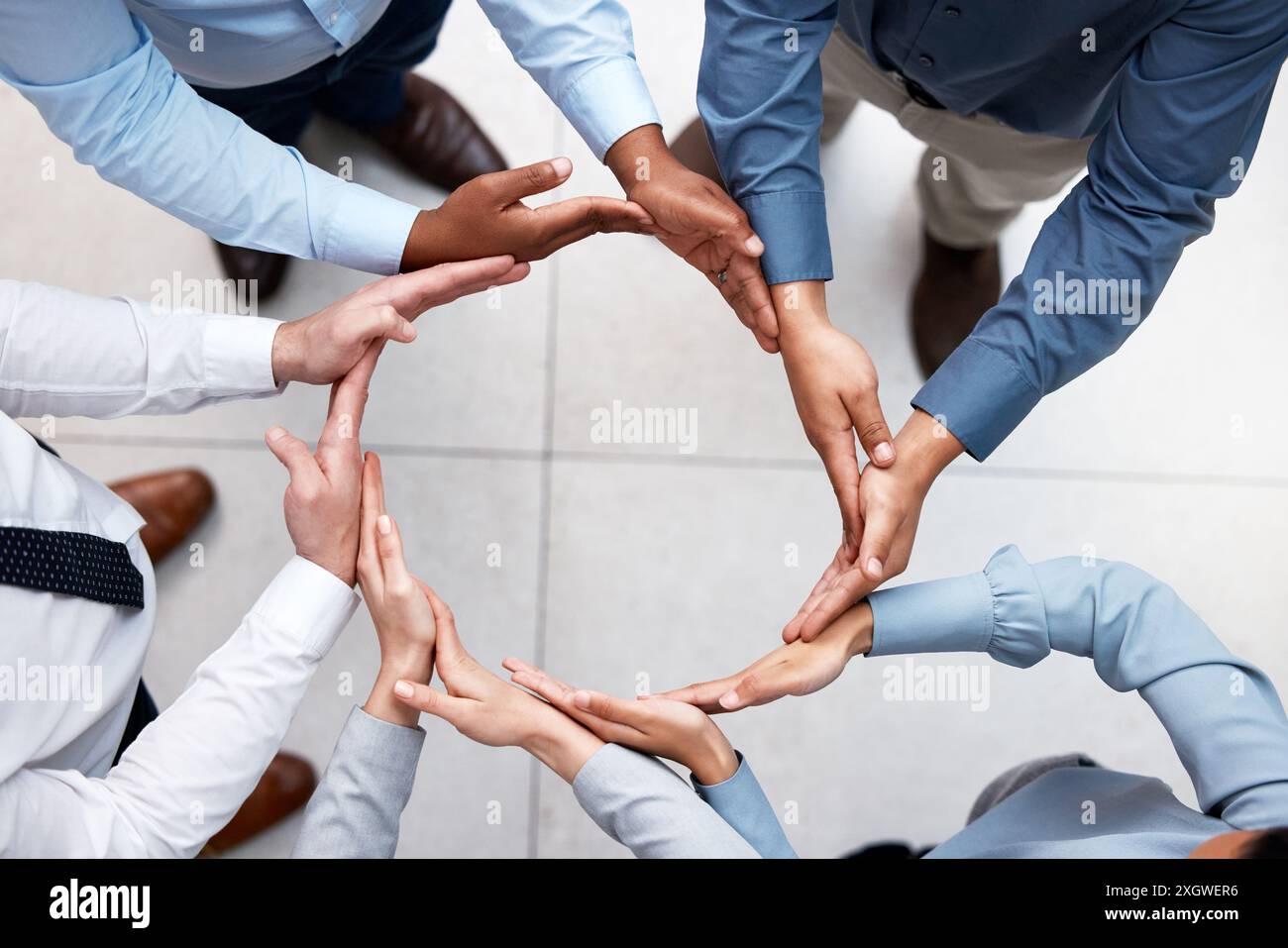 Employees, hands and synergy at meeting in circle, joint and ...