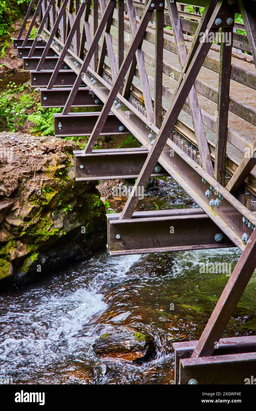 Wood and Metal Bridge Over Stream with Geometric Supports Perspective ...