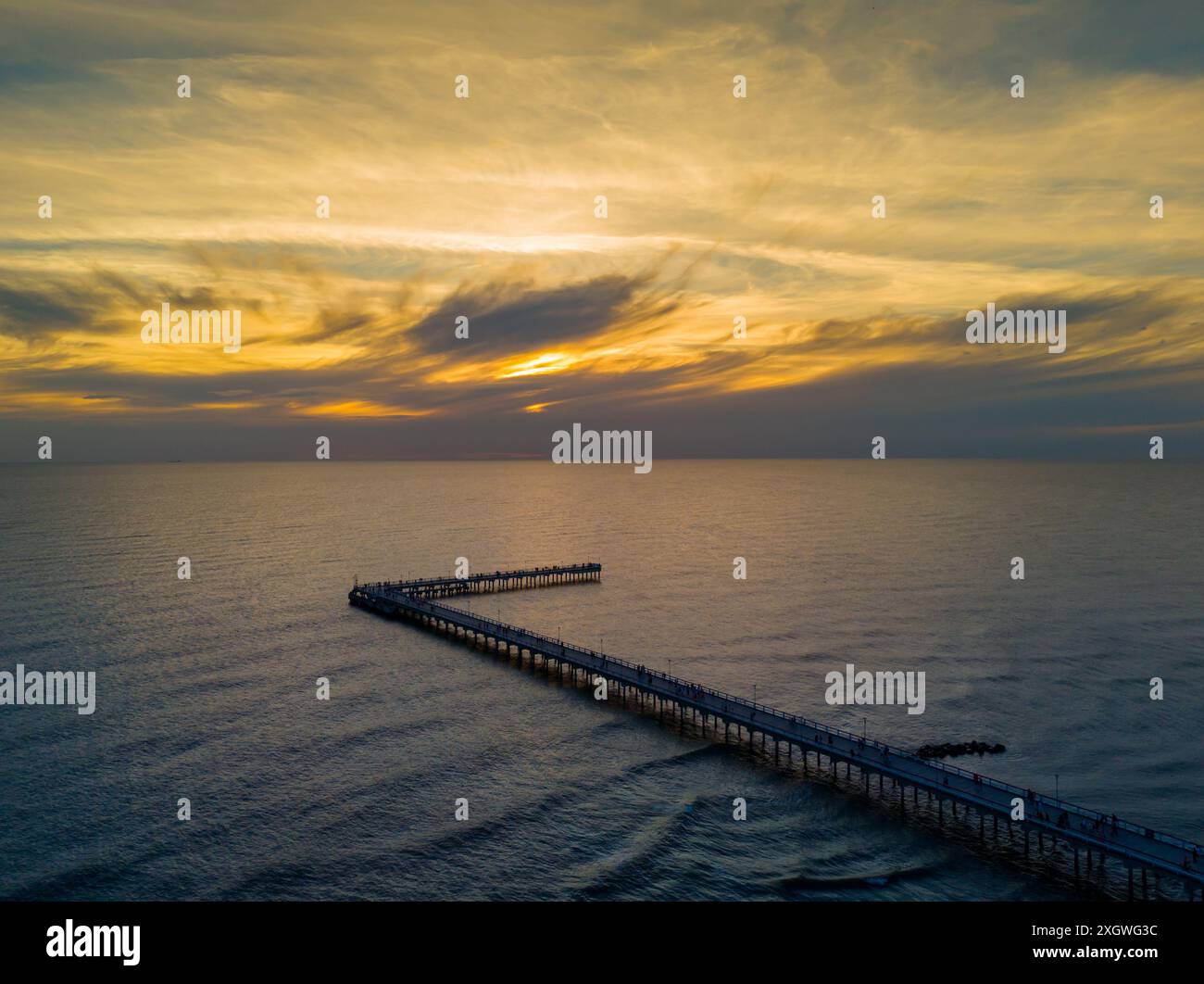 Colorful sunset and Palanga resort pedestrian bridge, pier. Aerial ...