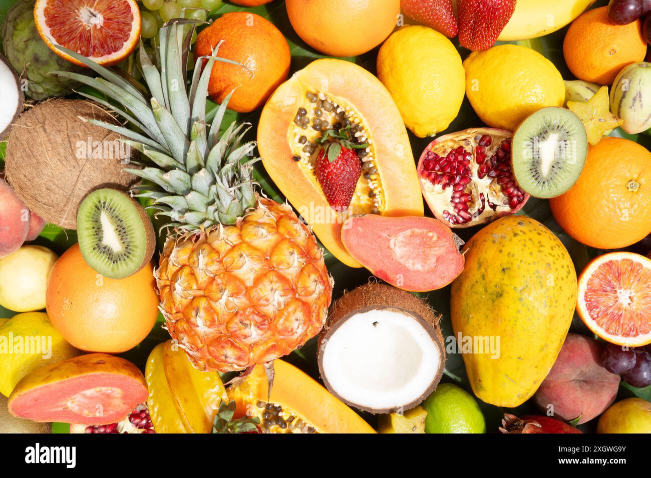 Summer mix of tropical fruits over white Stock Photo - Alamy
