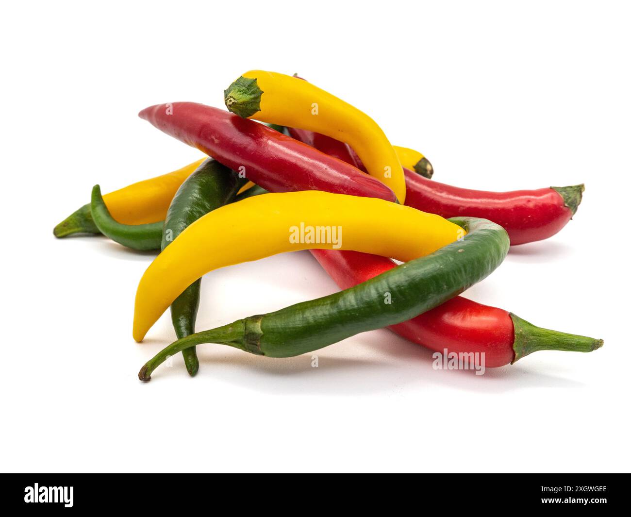 assorted fresh chili peppers on white background Stock Photo - Alamy