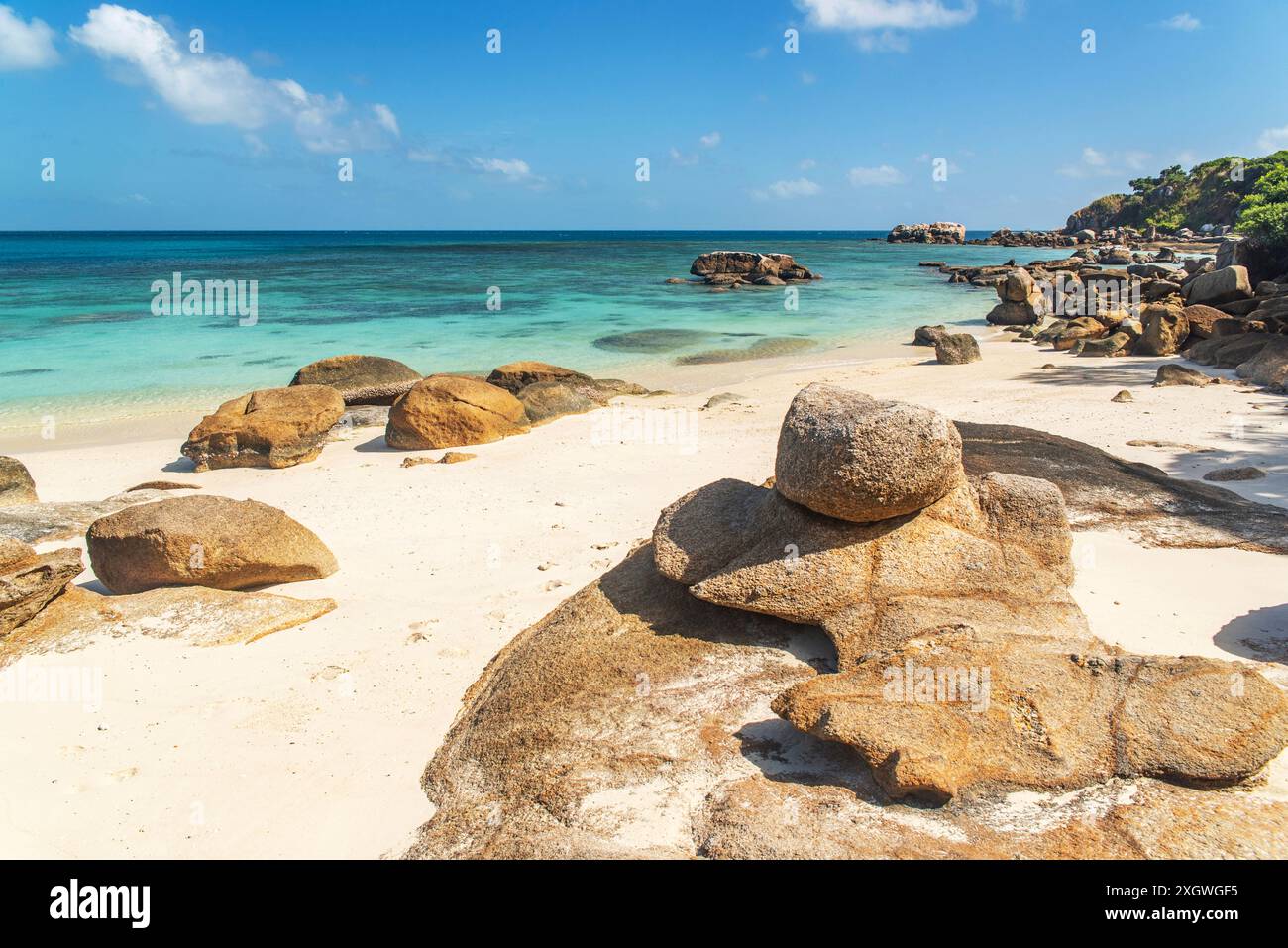 Picturesque tropical golden sandy Sunset Beach with turquoise water on ...