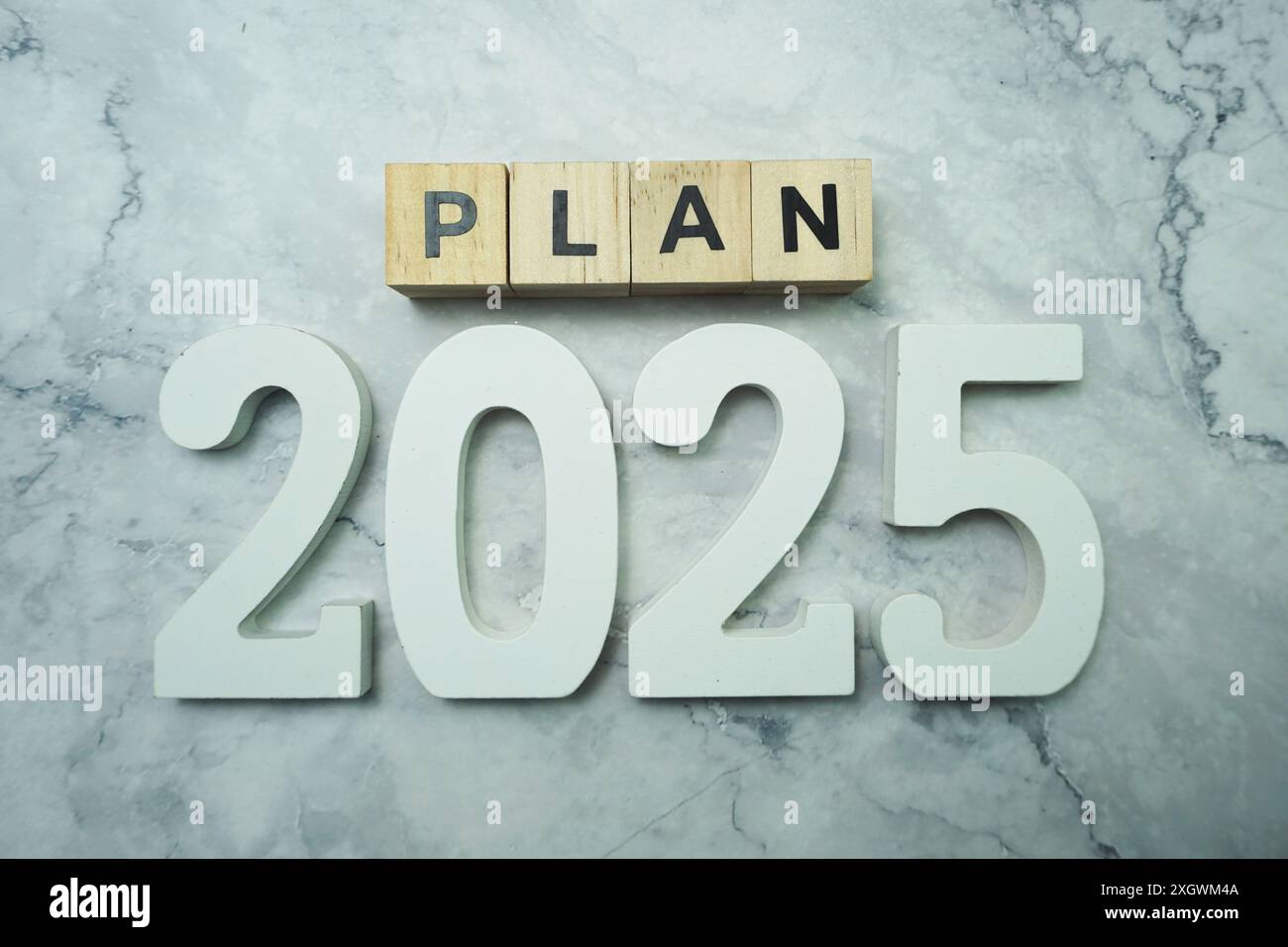 Plan 2025 alphabet letter on marble background Stock Photo - Alamy