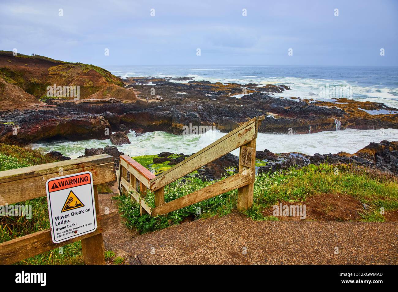 Rugged Coastal Safety Warning Sign with Crashing Waves Motion Stock ...