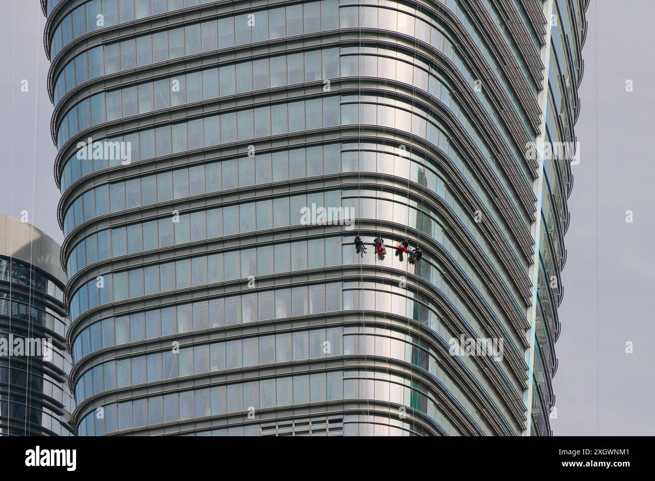 Industrial climbers on facade of high-rise building. Istanbul, Turkey ...