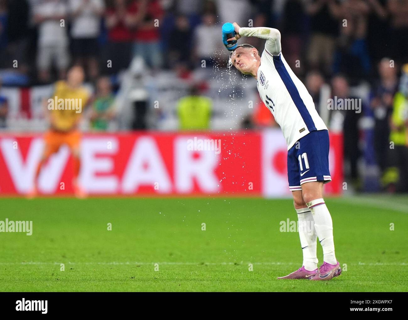 England's Phil Foden rinses his face during the UEFA Euro 2024, semi ...
