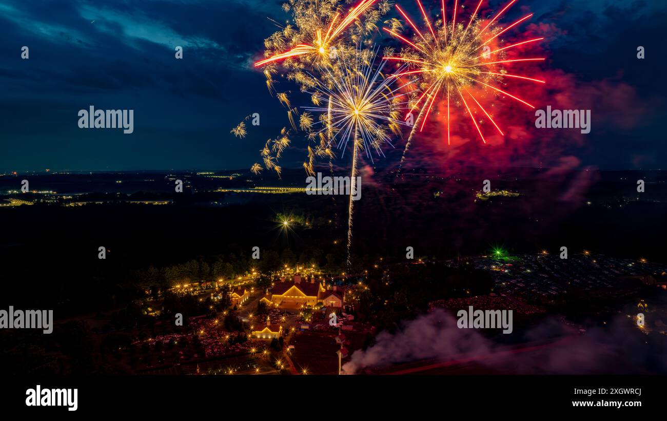 Bright Red And Gold Fireworks Light Up The Night Sky Over A Picturesque ...