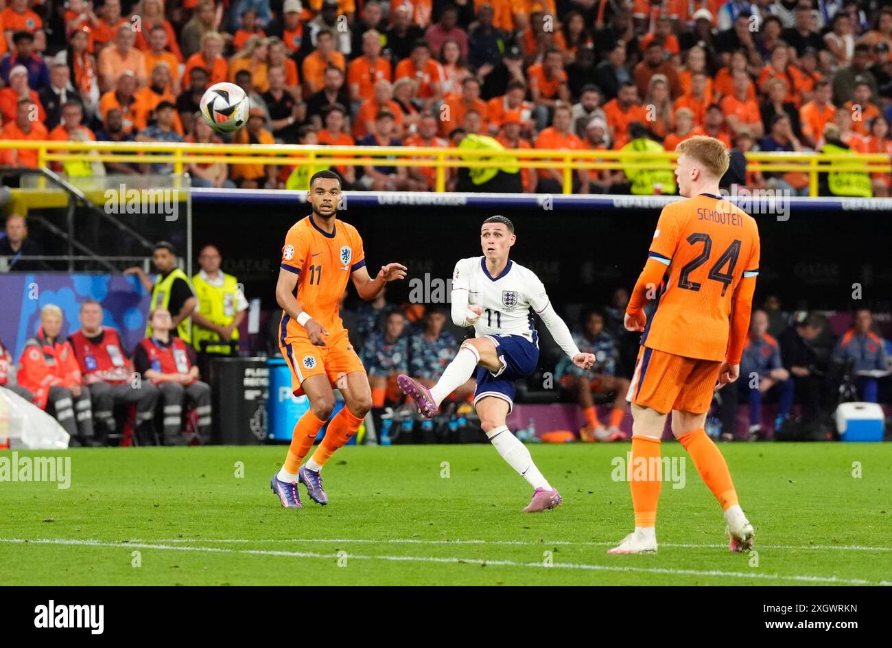 England's Phil Foden shoots and watches as his shot hits the post ...