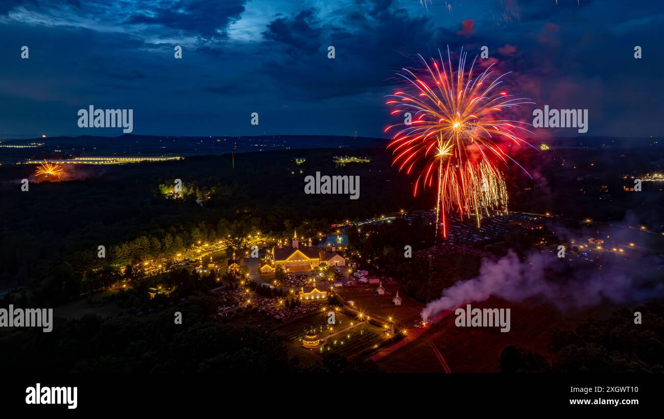 Bright Red And Gold Fireworks Light Up The Night Sky Over A Picturesque ...