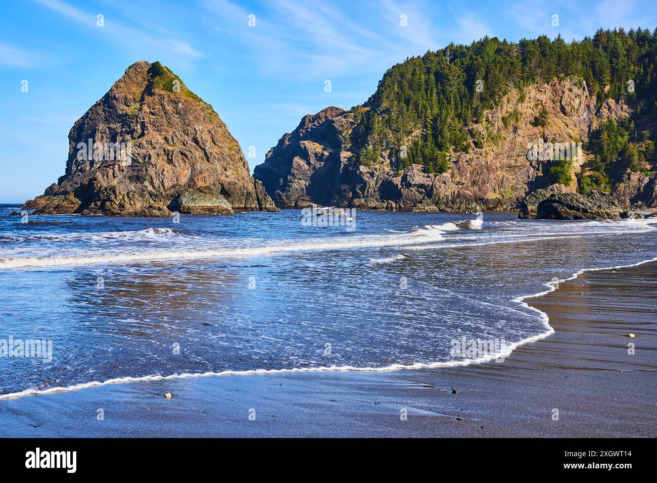 Rugged Rock Formations and Beach Reflections at Eye Level Stock Photo ...
