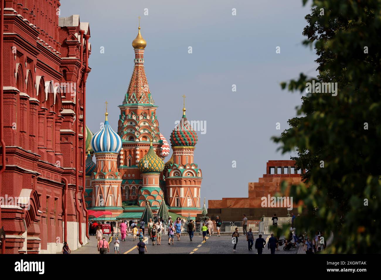 People walking on Red square in Moscow on background of the St. Basil's ...