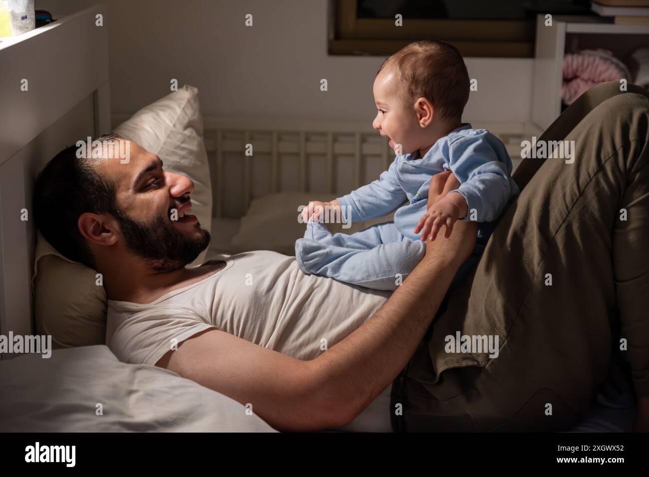 Happy father holding crying newborn hi-res stock photography and images ...