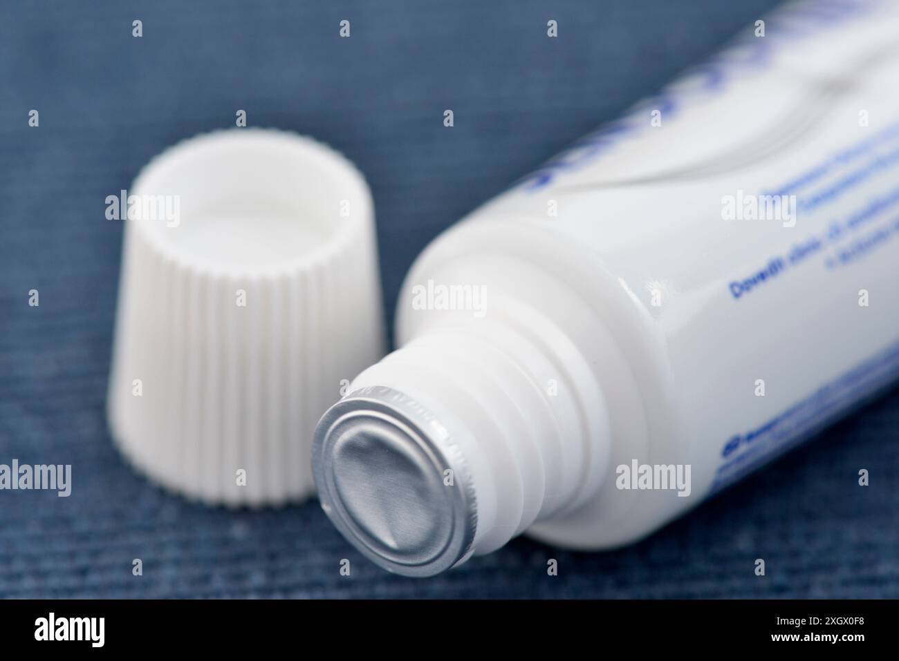 Sealed toothpaste tube Sensodyne Repair & Protect close up detail on ...