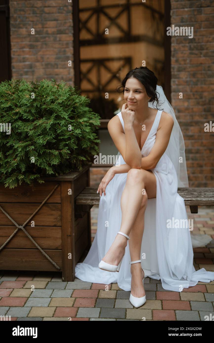 preparations for the bride with the dressing of the wedding dress in ...