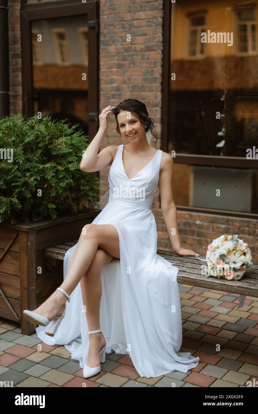 preparations for the bride with the dressing of the wedding dress in ...