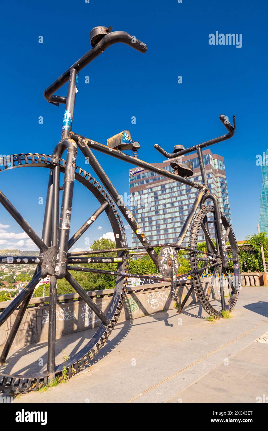 Tbilisi, Georgia - 23 JUNE, 2024: Gigantic bicycle statue with two ...