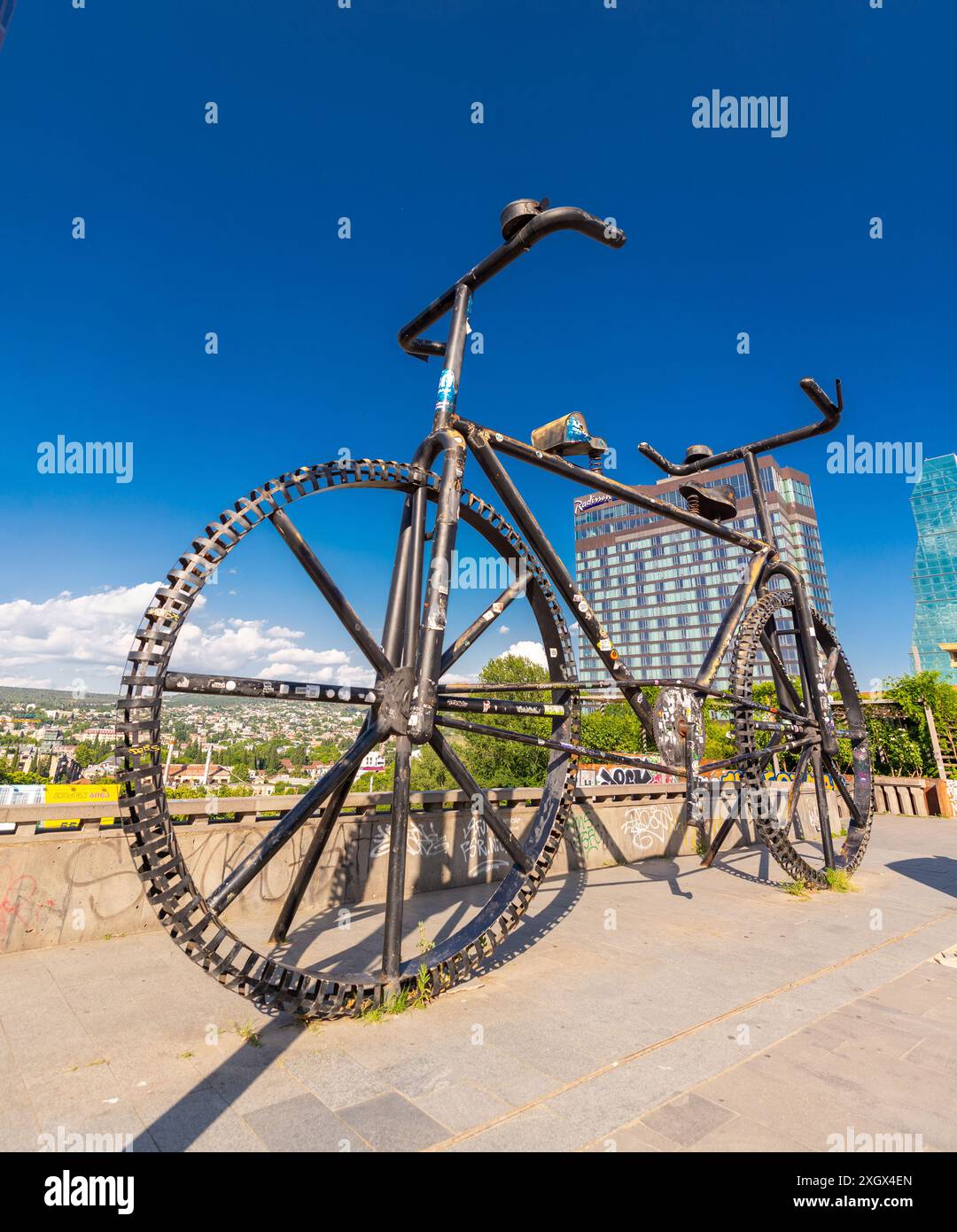 Tbilisi, Georgia - 23 JUNE, 2024: Gigantic bicycle statue with two ...