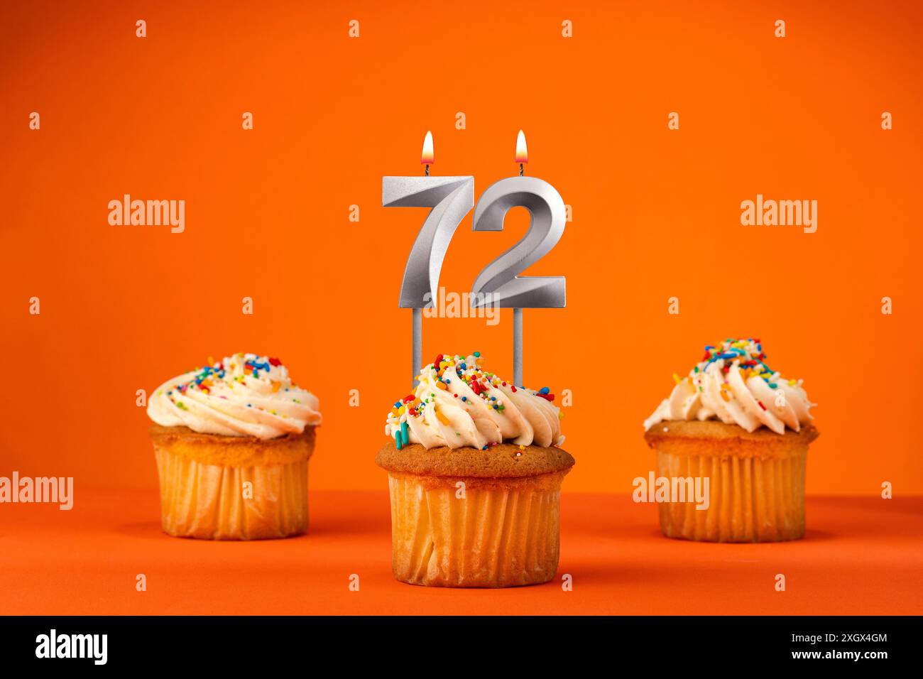 Birthday celebration in orange color - Candle number 72 Stock Photo - Alamy