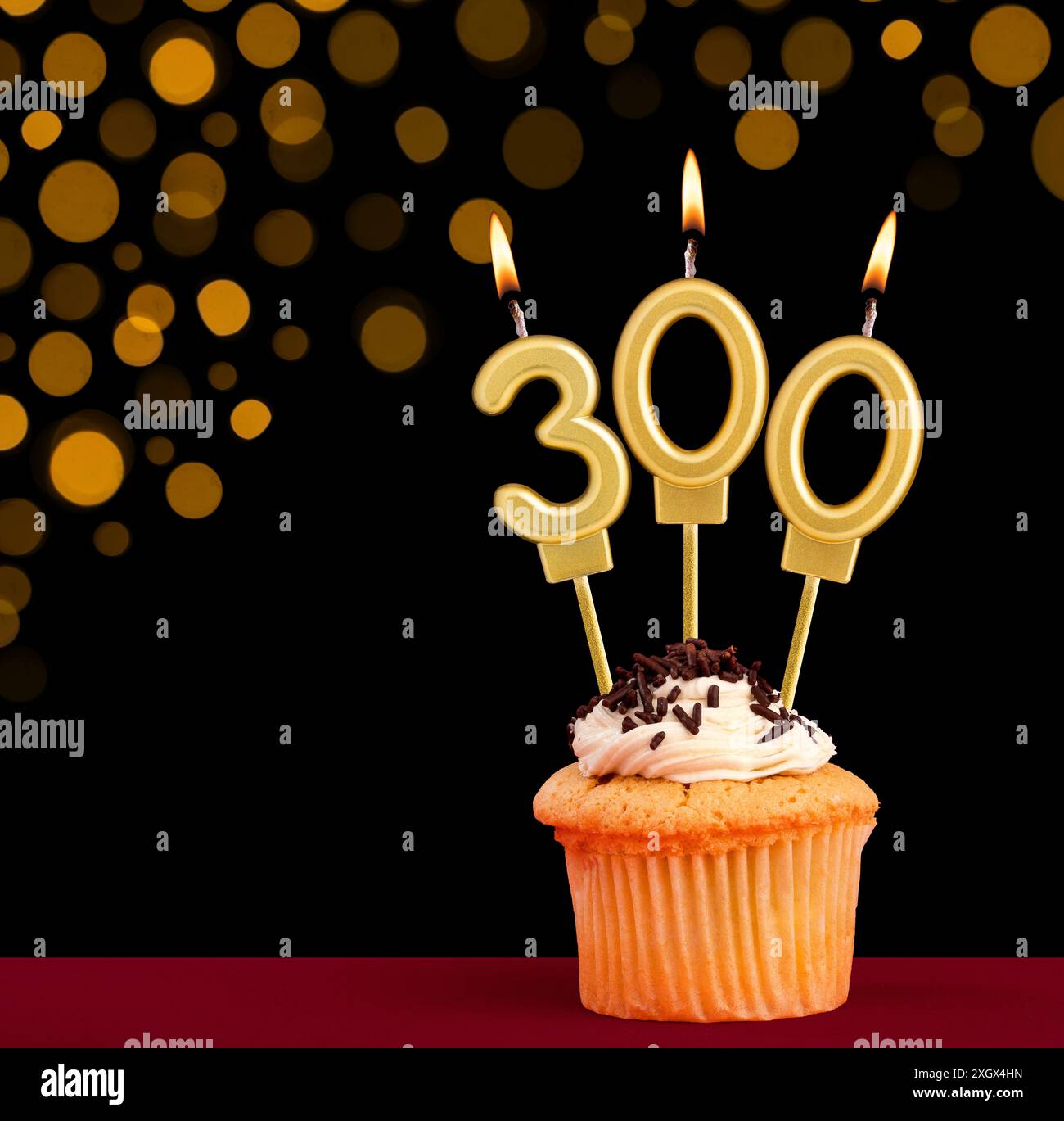 Number 300 birthday candle - Cupcake on black background with out of ...