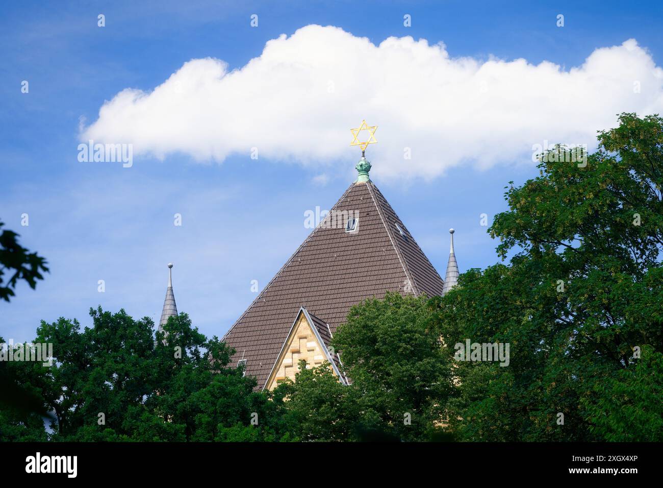 a cloud over the roof with the david star of the cologne synagogue ...
