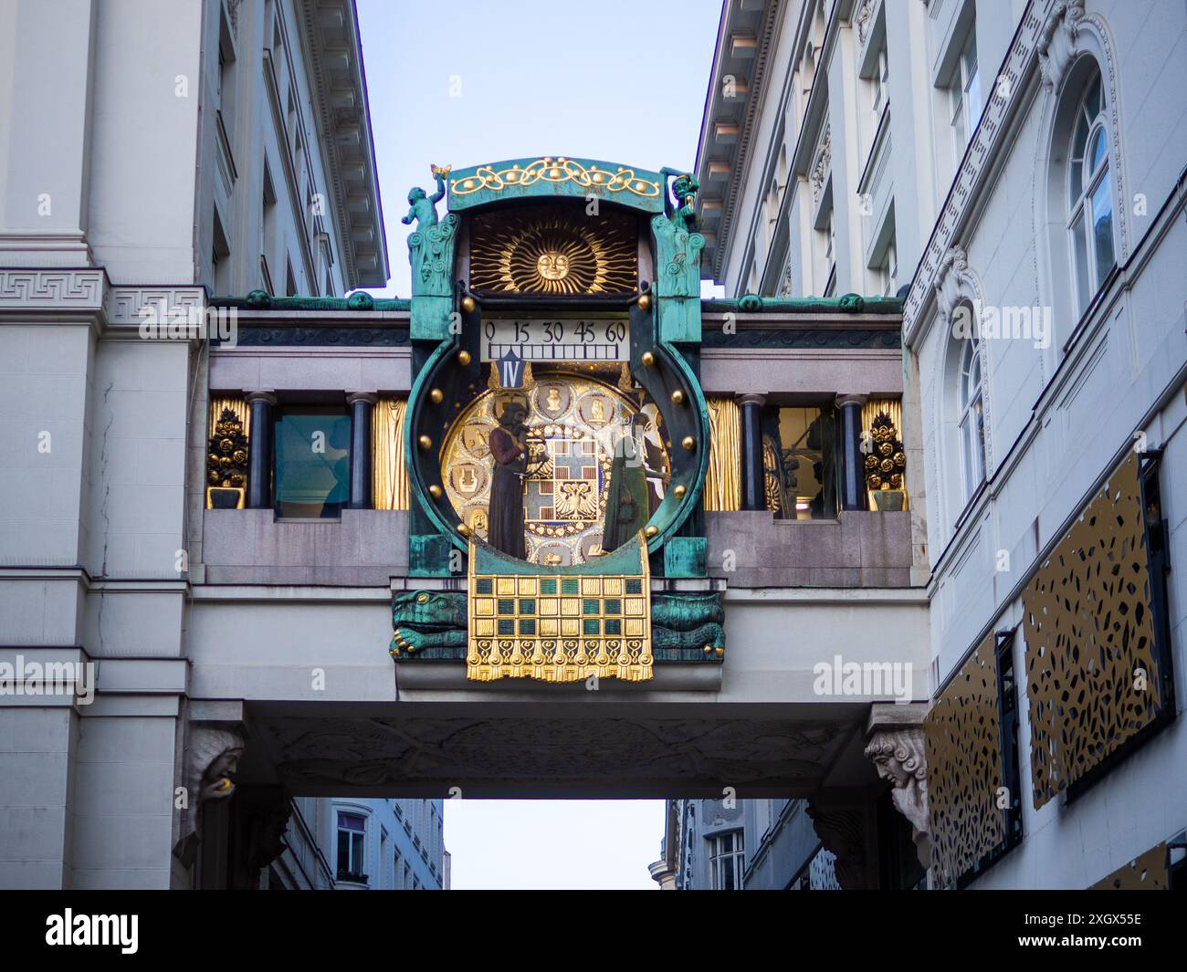 A historic clock with copper accents and figures that move around on ...
