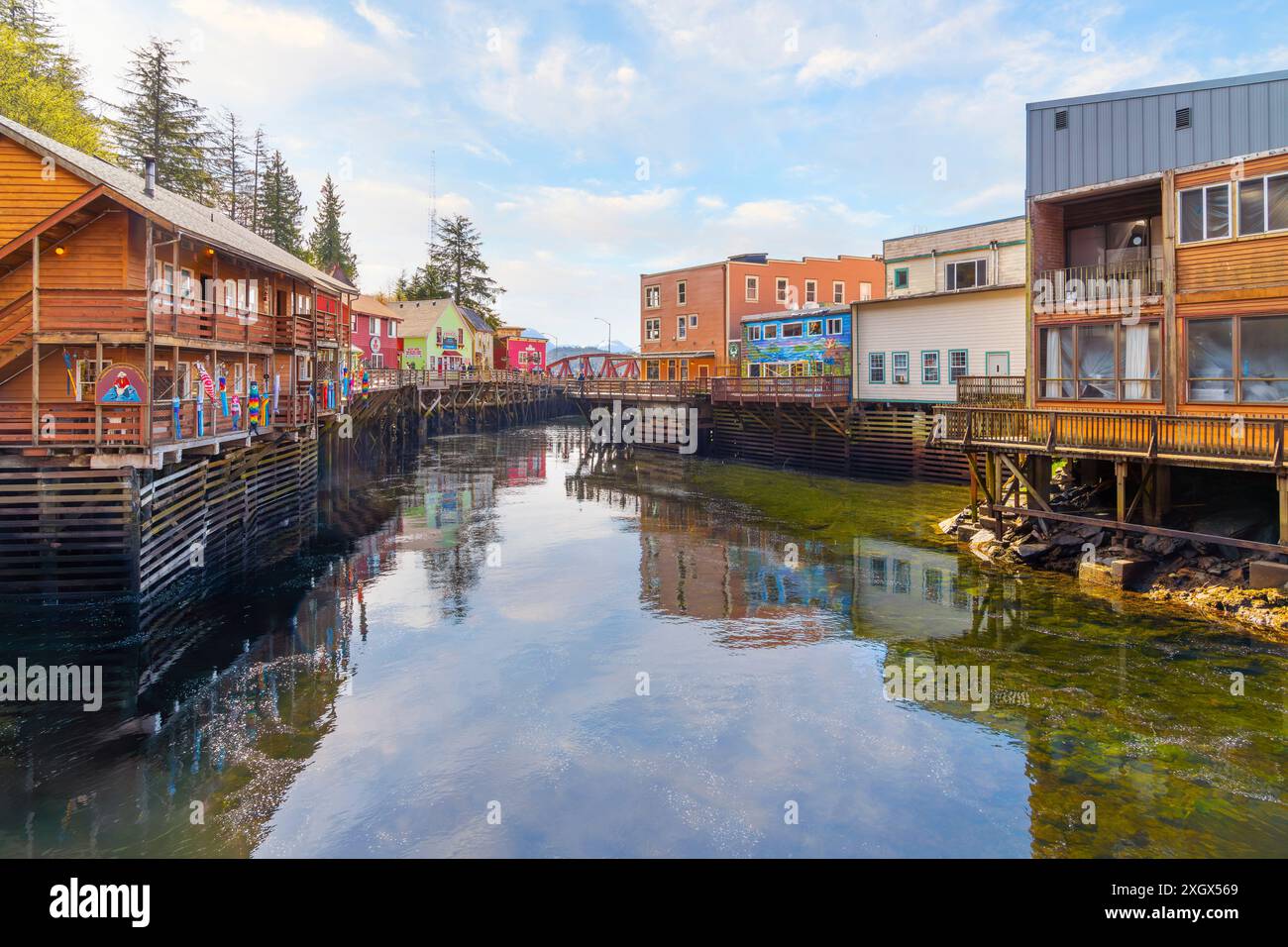 Historic colorful shops along Ketchikan Creek at Creek Street, a ...