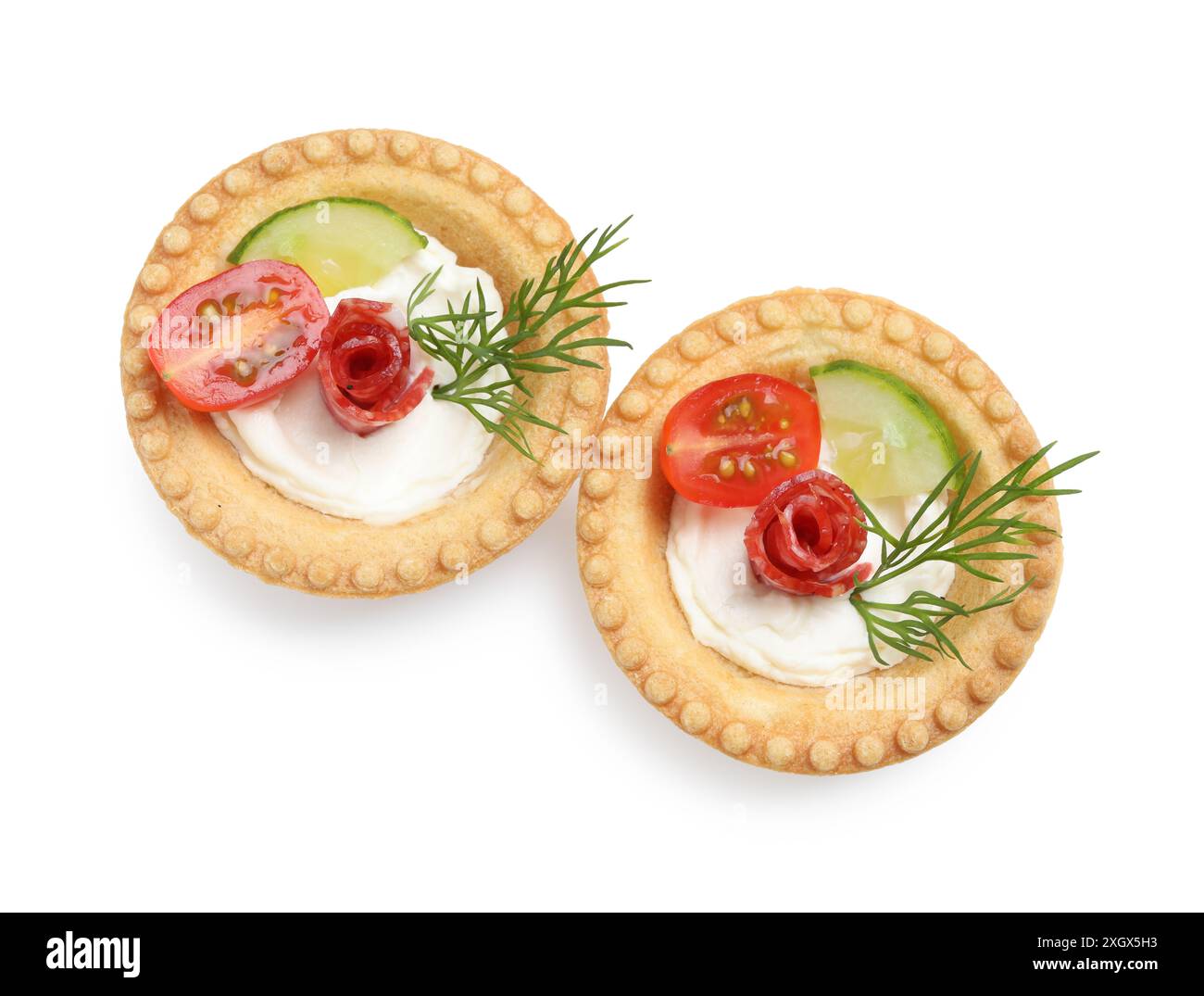 Delicious canapes with dry smoked sausages, cream cheese and vegetables ...