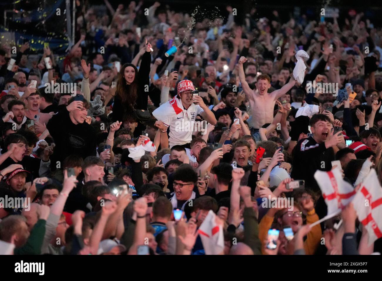 England fans at Millennium Square, Leeds, celebrate after England's win ...