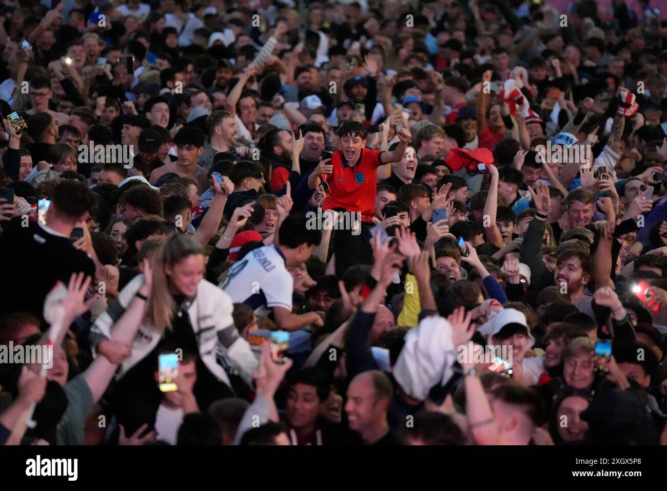 England fans at Millennium Square, Leeds, celebrate after England's win ...