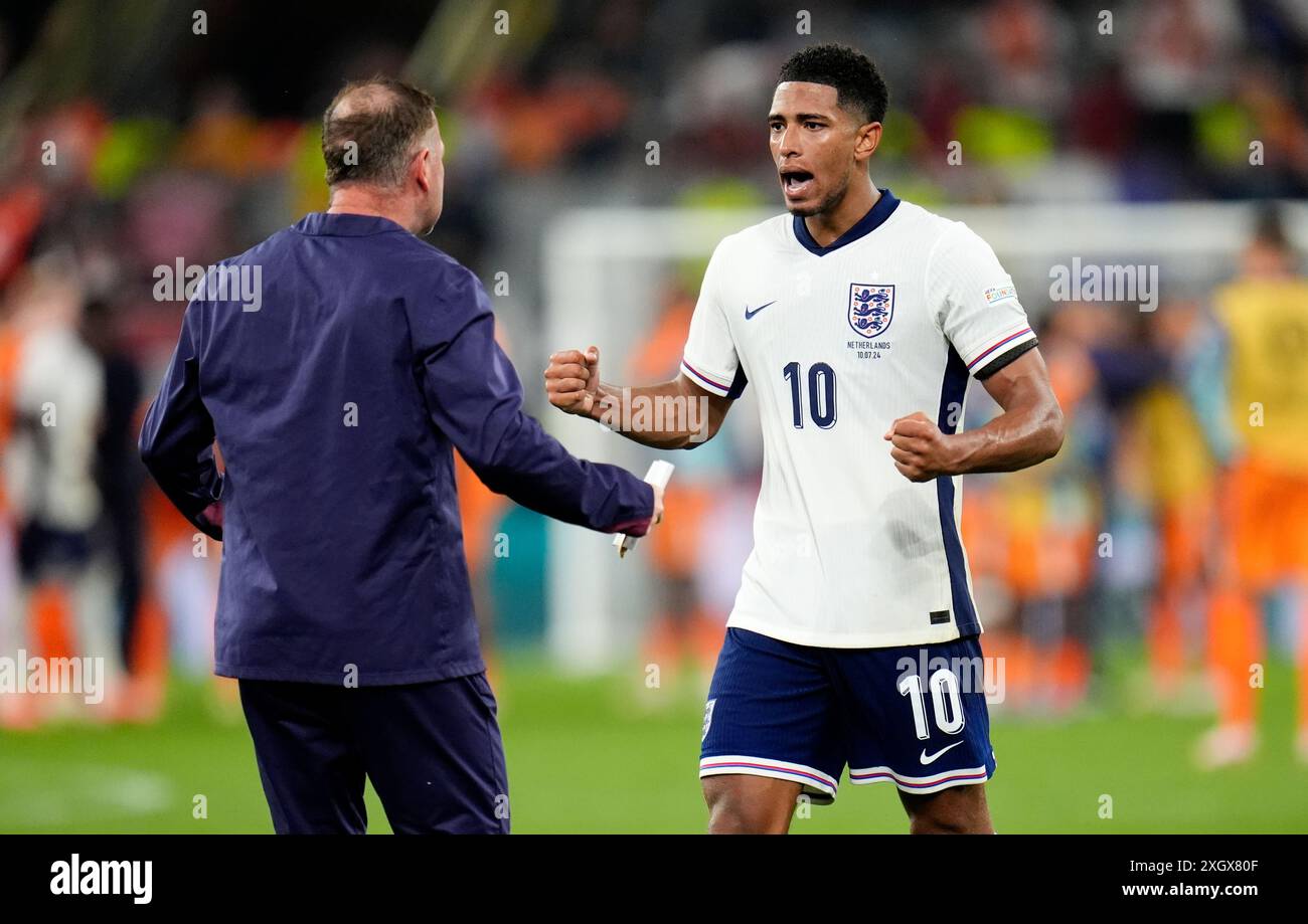 England's Jude Bellingham celebrates the win with assistant manager ...