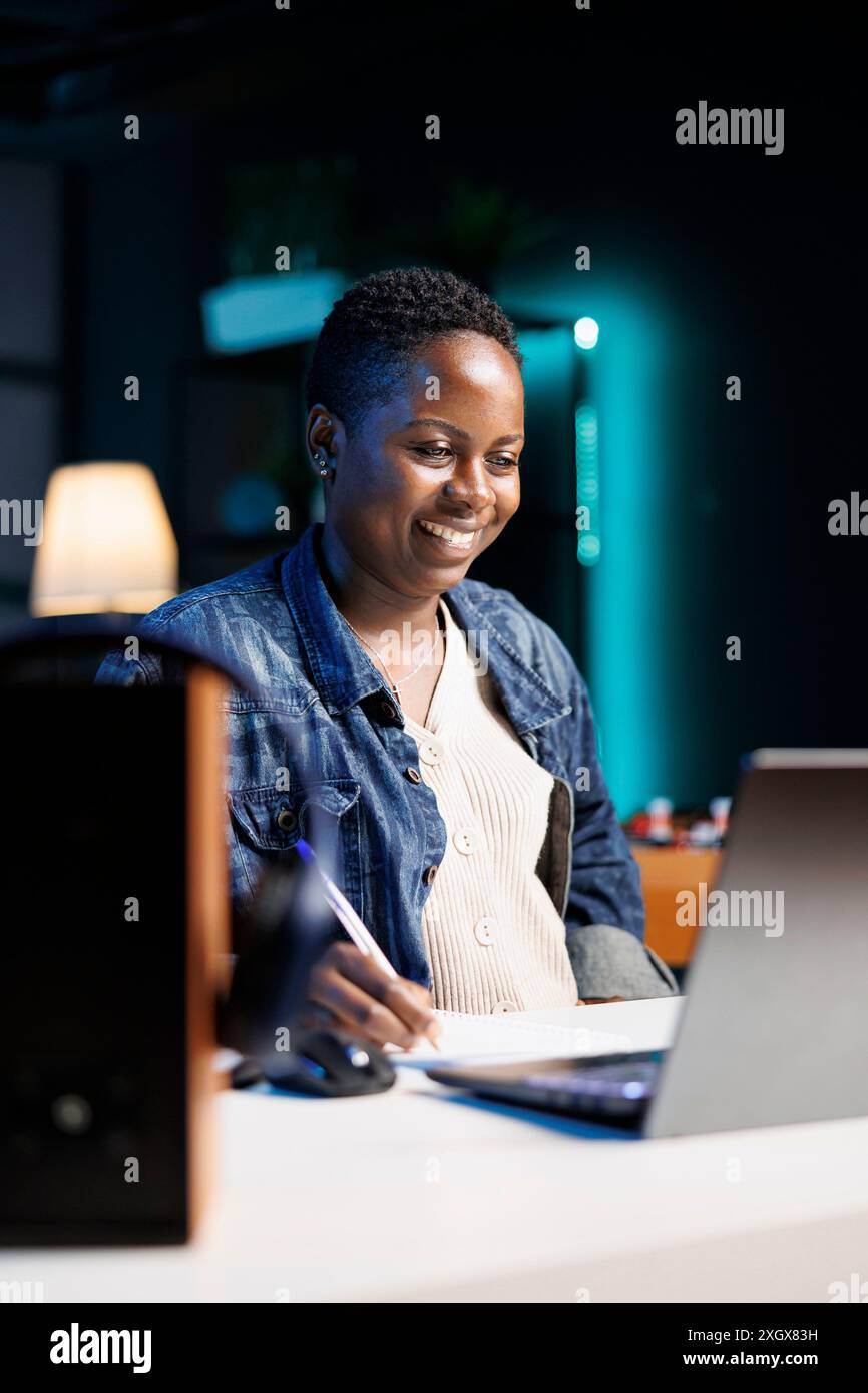 Smiling black woman with a pen, brainstorming ideas, and reviewing ...