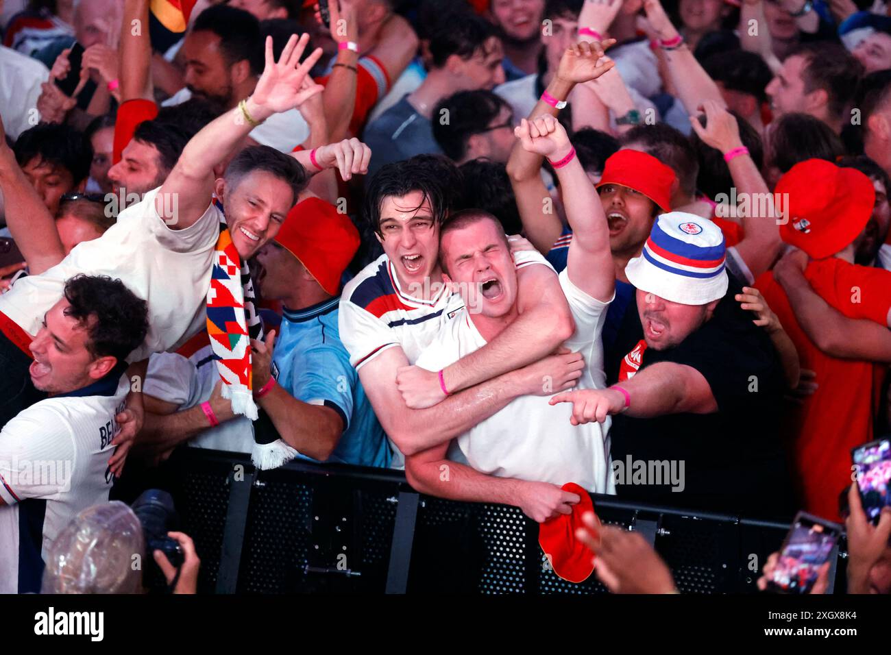 England fans celebrate at BOXPark Wembley, London, after a screening of ...