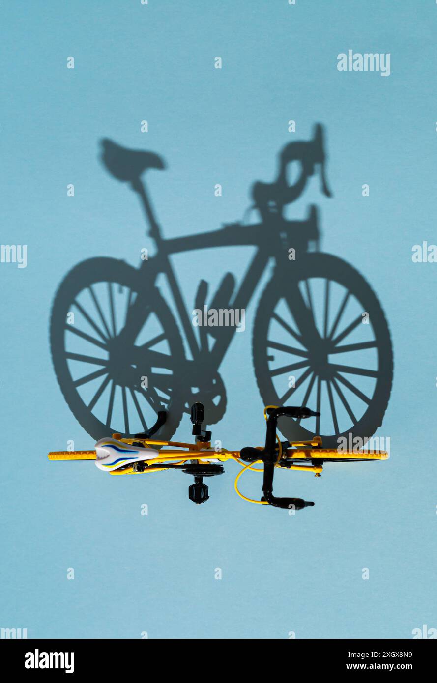 Yellow bicycle on blue background. An original background image with a ...