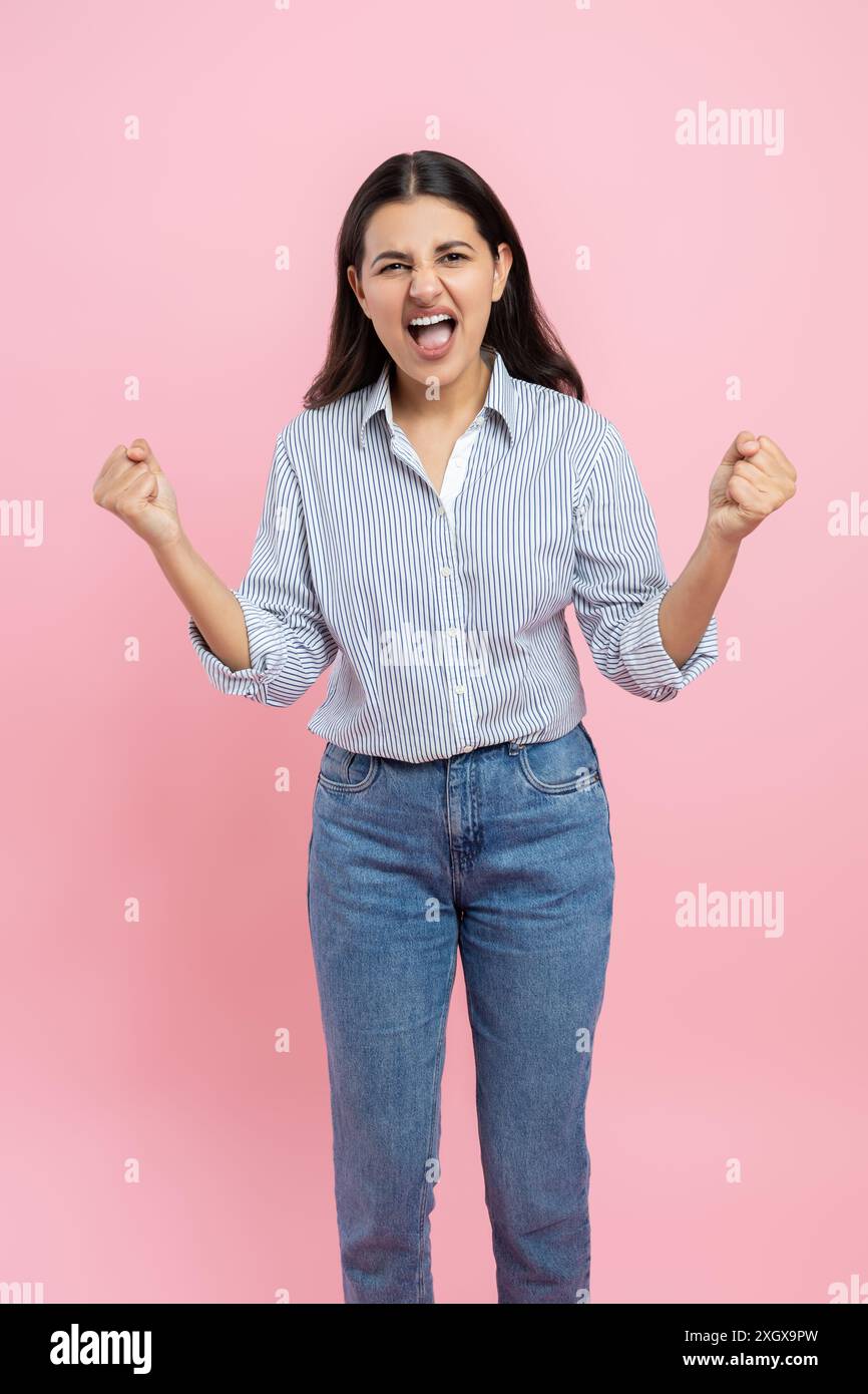 Angry Indian woman screaming with aggression with clenched fits Stock ...