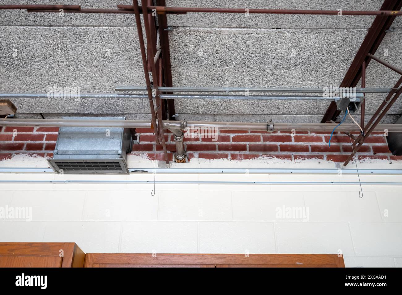 Old ceiling mounted glass drain, vent, pipes in school science room or ...