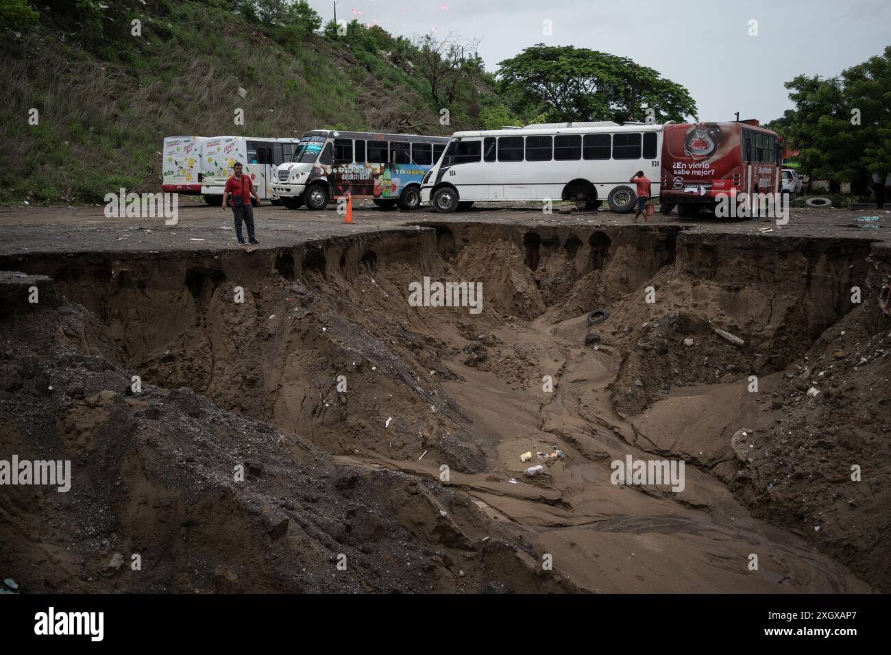 Veracruz, Mexico. 10th July, 2024. A man observes a landslide after ...