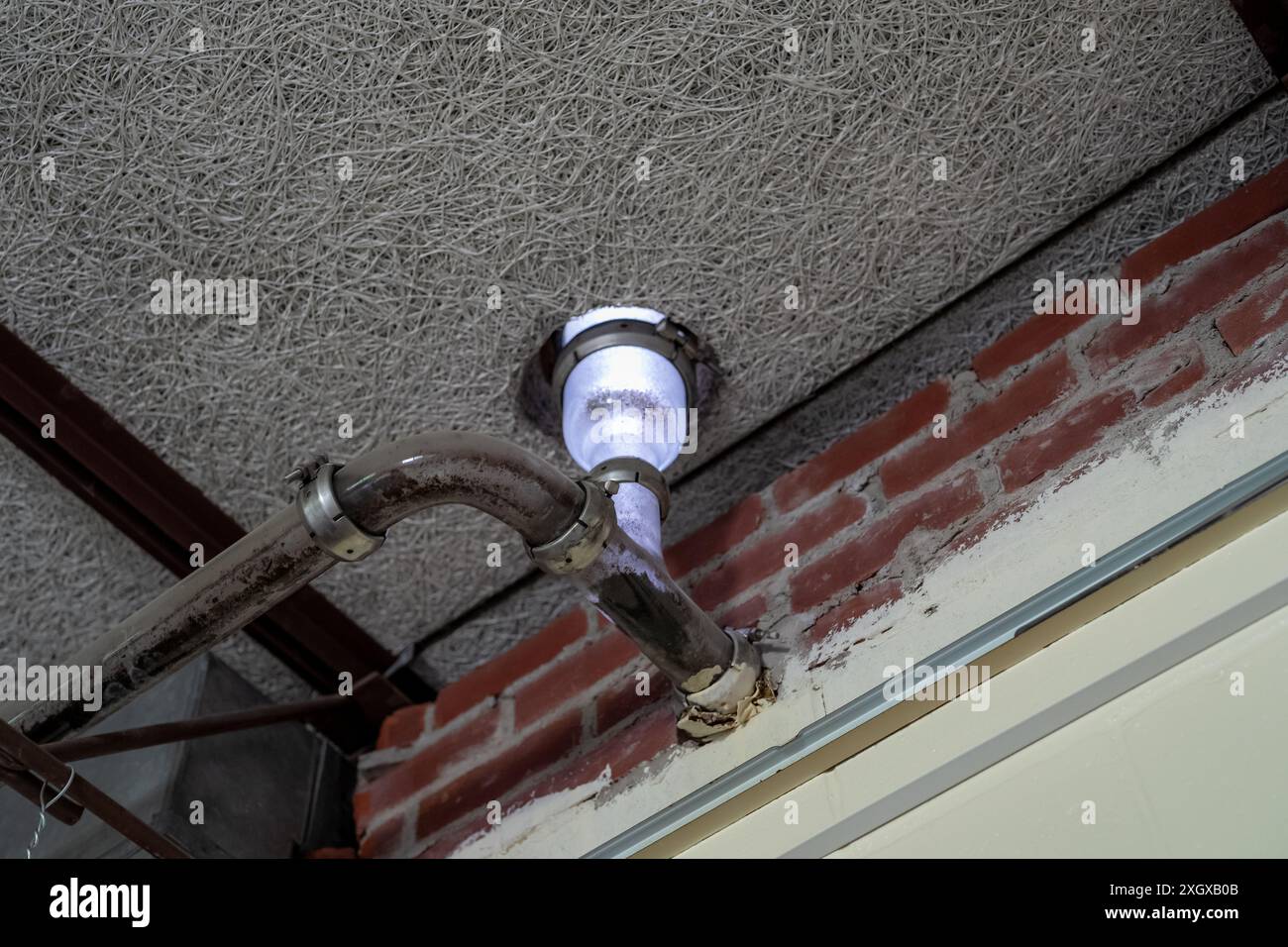 Old ceiling mounted glass drain, vent, pipes in school science room or ...