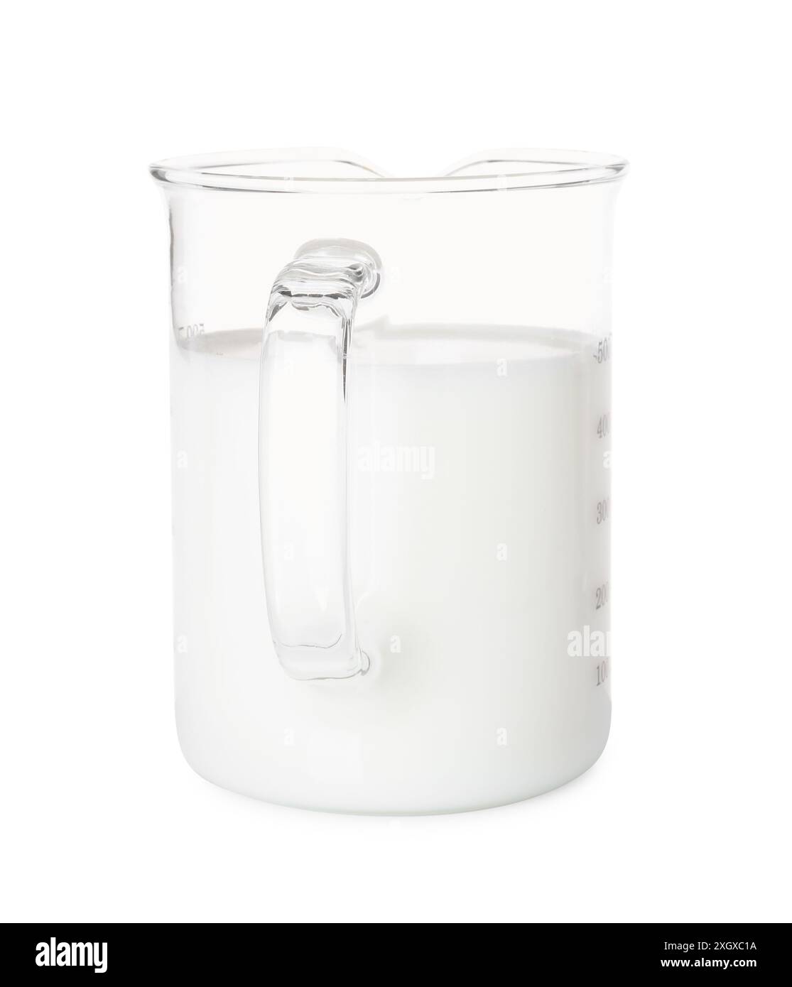 Fresh milk in measuring cup isolated on white Stock Photo - Alamy