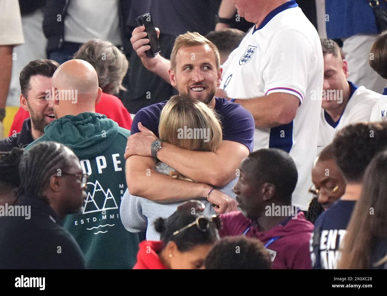 England's Harry Kane hugs wife Katie Goodland following the UEFA Euro ...