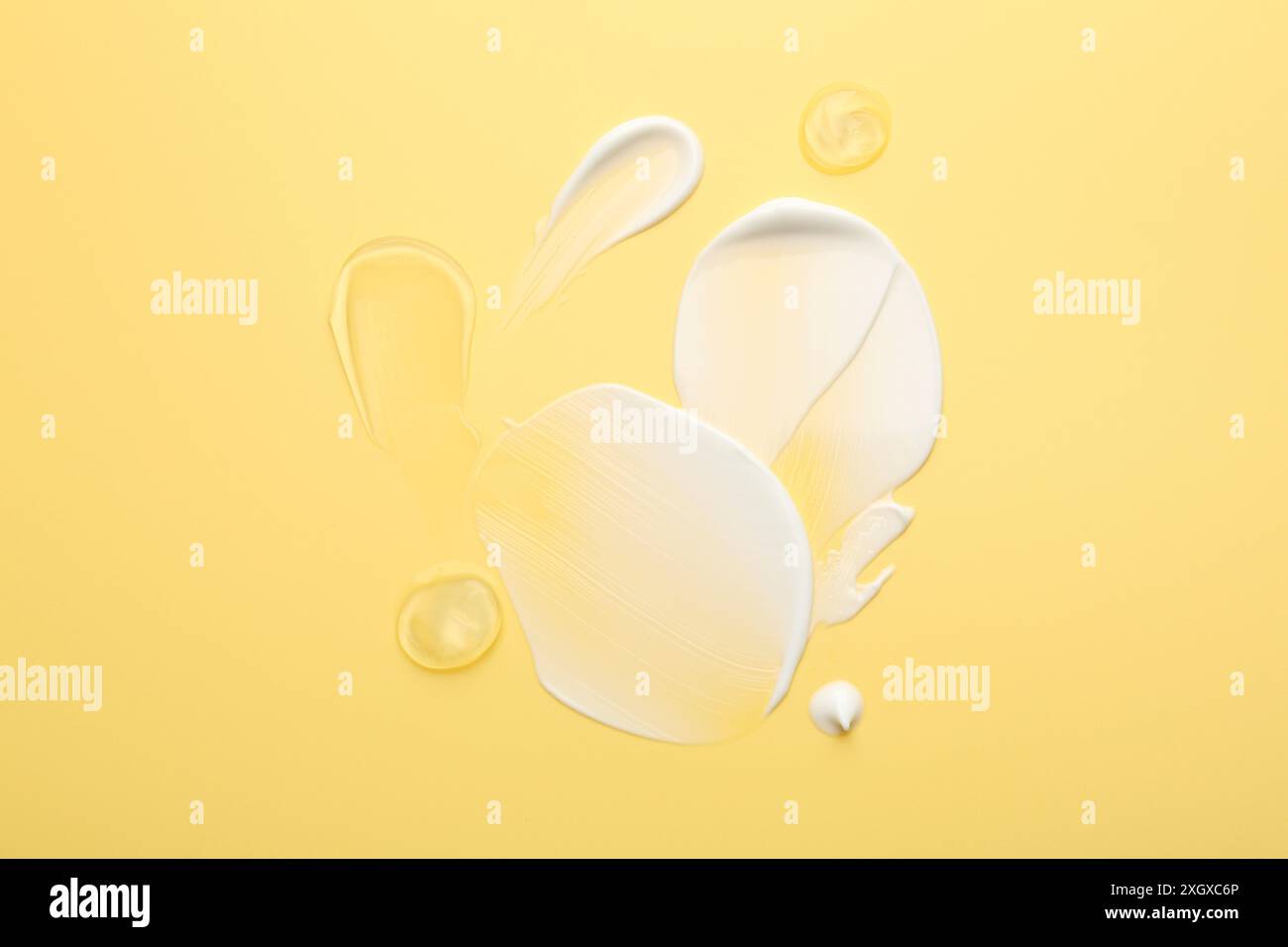 Samples of face cream on yellow background, top view Stock Photo - Alamy