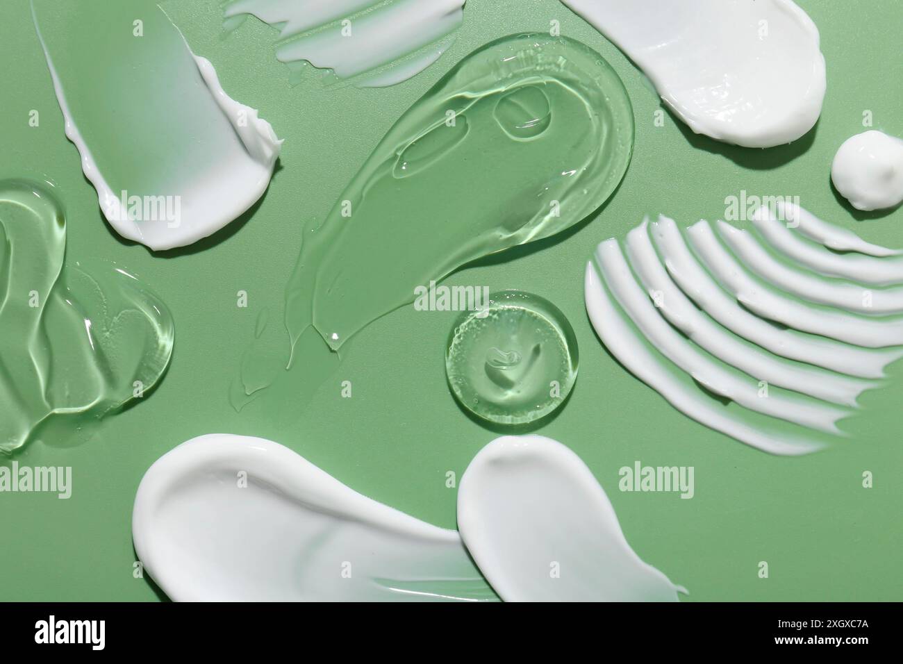 Samples of face cream on green background, top view Stock Photo - Alamy