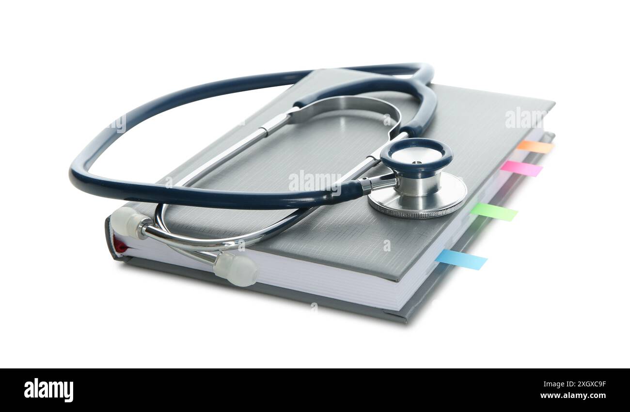 Stethoscope and closed book isolated on white Stock Photo - Alamy