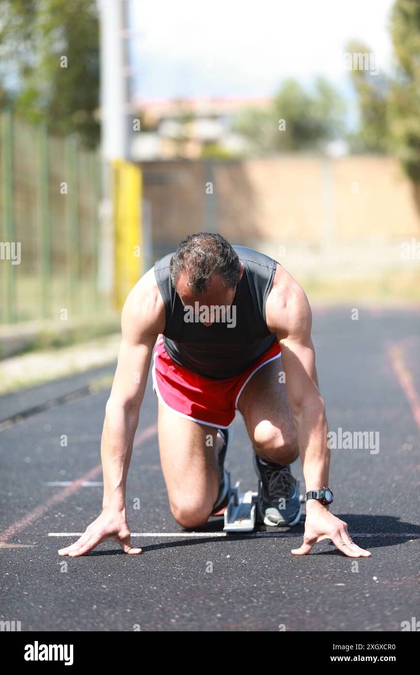 Athlete in the starting blocks hi-res stock photography and images - Alamy