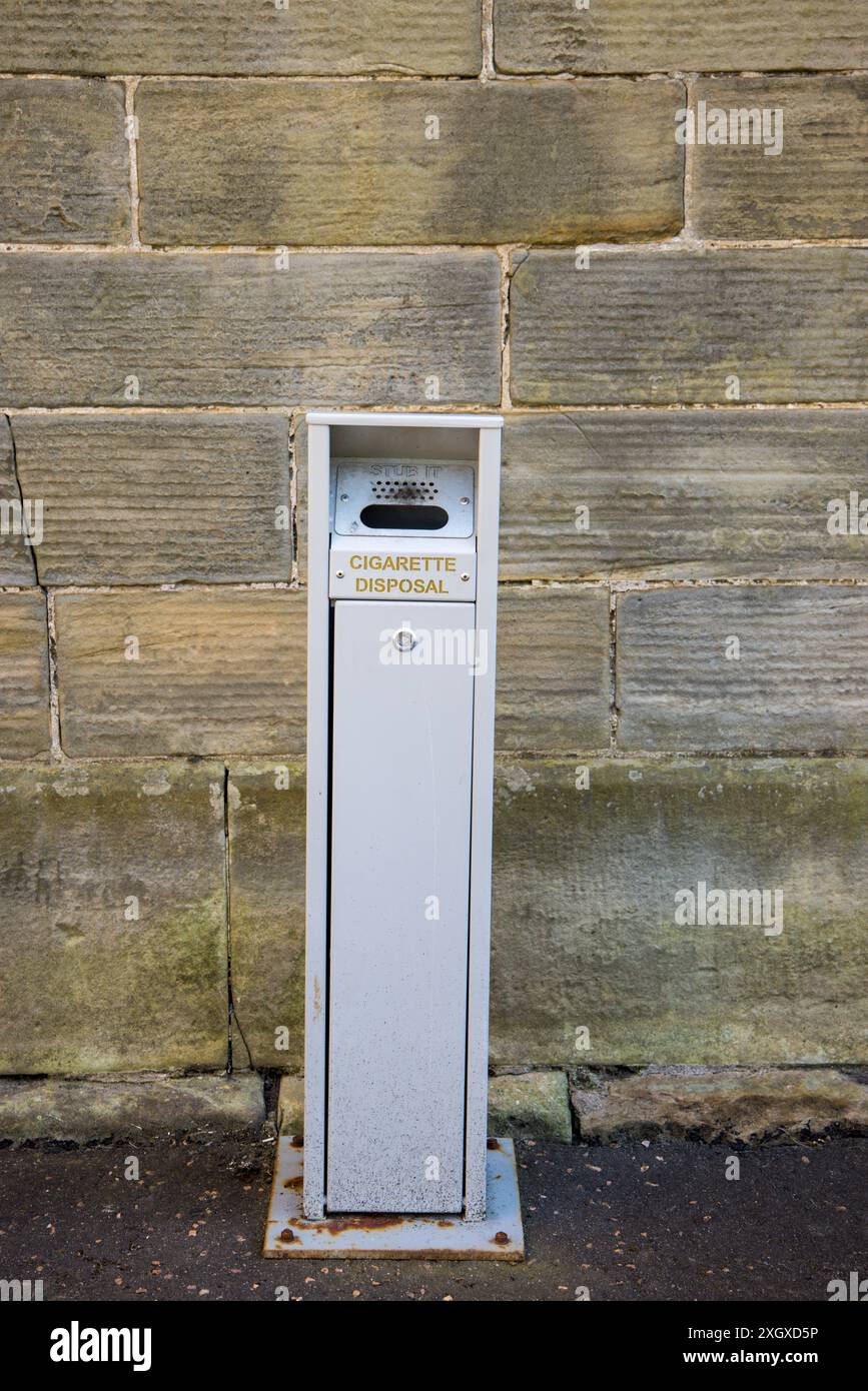 Public metal bin for cigarette disposal in a street in Scotland, near ...