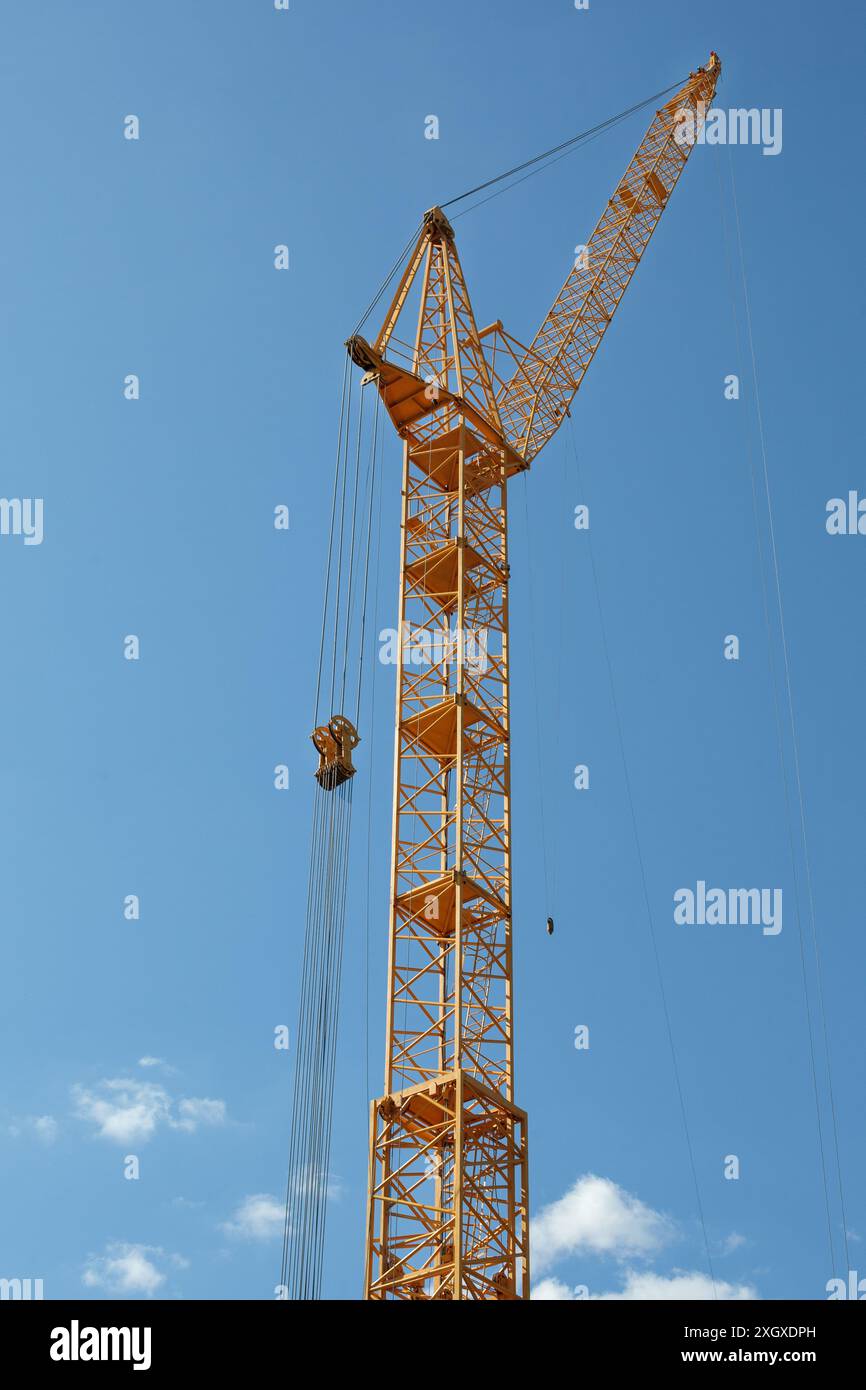 Yellow Construction Crane Against Blue SkySS Stock Photo - Alamy