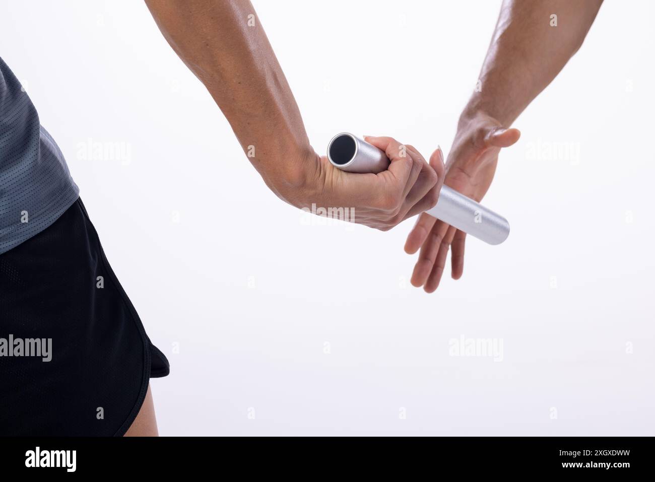 Close-up of a relay race with athletes passing the baton on a white ...