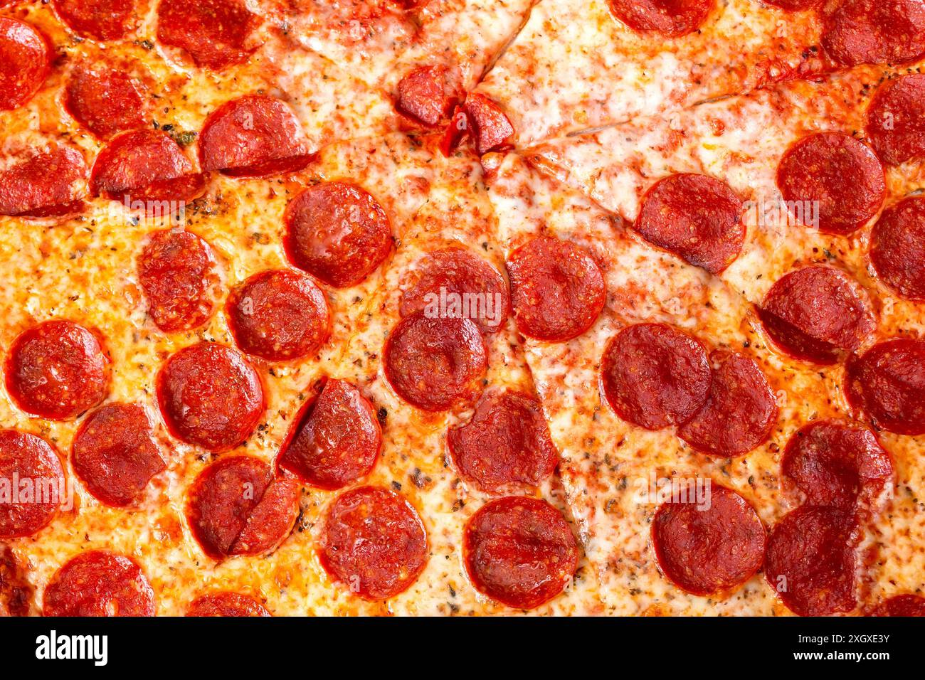 A top down view of a rustic pepperoni pizza with slices Stock Photo - Alamy